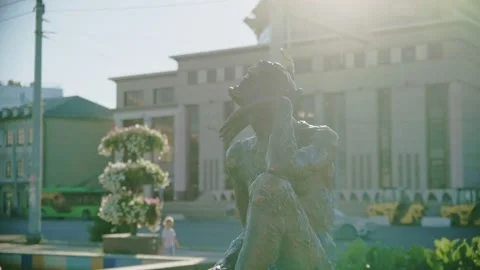 Dreaming devil statue in city park again... | Stock Video | Pond5