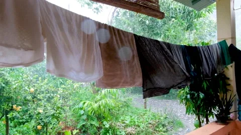 Drenched wet clothes on the washing line... | Stock Video | Pond5