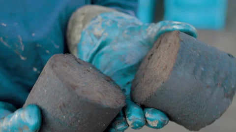 Drill core from oil well in hand | Stock Video | Pond5