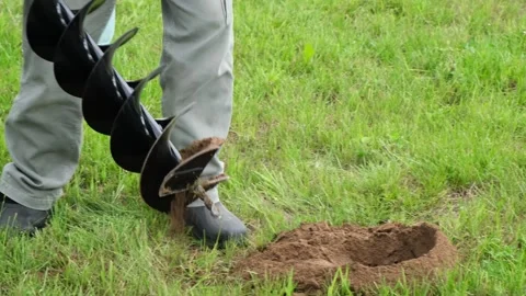 Drill the ground. The man drilling the l... | Stock Video | Pond5