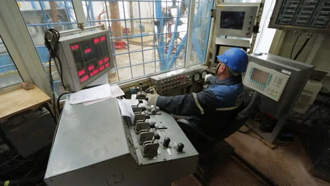 A drilling rig worker works in a drillin... | Stock Video | Pond5