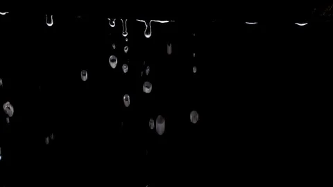 Dripping water (rain) on a black backgro... | Stock Video | Pond5