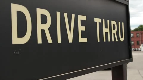 drive thru sign in white capital letters... | Stock Video | Pond5