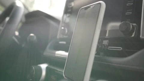 Driver driving car using mobile phone wi... | Stock Video | Pond5