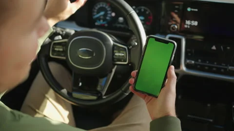 The driver has a handheld mobile phone w... | Stock Video | Pond5