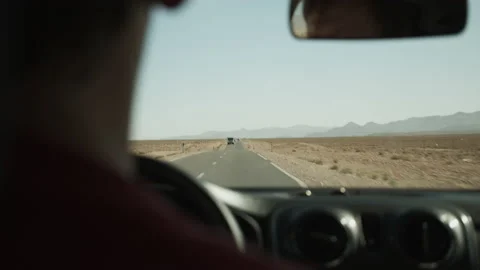 Driver over shoulder view of asphalt roa... | Stock Video | Pond5