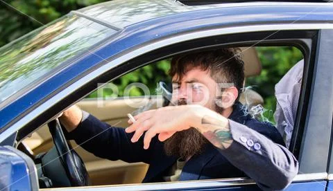 Driver smoking cigarette. Minute to relax. Businessman tired after hard ...