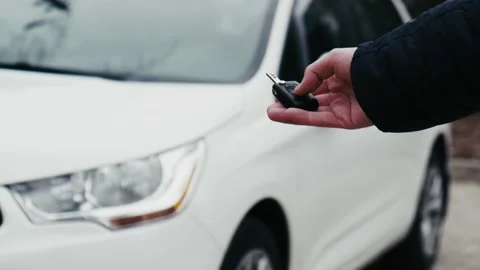 Driver unlocking the car by the car's ke... | Stock Video | Pond5