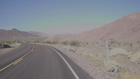 Driving Along A Desert Road Turn Corner ... | Stock Video | Pond5