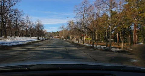 Driving a car through a town in winter | Stock Video | Pond5
