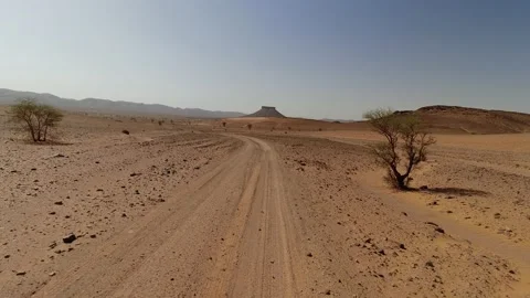 Driving fast on a long stretch of desert... | Stock Video | Pond5