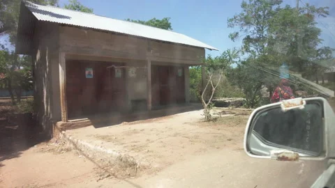 Driving Past Slums and Villages with Dil... | Stock Video | Pond5