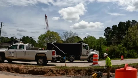 Driving through construction zone worker... | Stock Video | Pond5