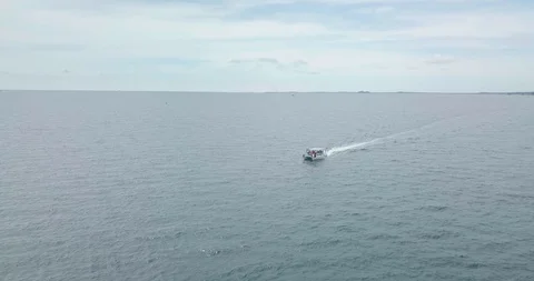 Drone aerial view of a boat approaching ... | Stock Video | Pond5