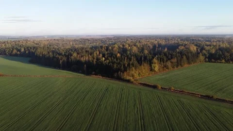 Drone ascends over a farming field and r... | Stock Video | Pond5