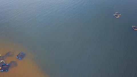 Drone bird's eye view of fishing cages s... | Stock Video | Pond5