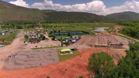 Drone: BMX Event at Mountain Bike Park | Stock Video | Pond5