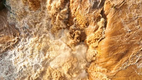 Drone captures dramatic waterfall flood | Stock Video | Pond5