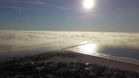Drone captures fog rolling onto beach fr... | Stock Video | Pond5