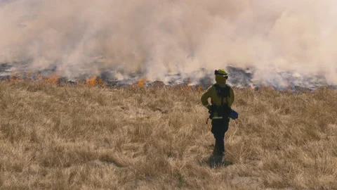 Drone Close Up of lone Firefighter stand... | Stock Video | Pond5