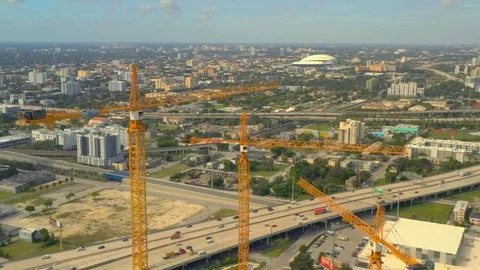 Drone crane flying over construction sit... | Stock Video | Pond5