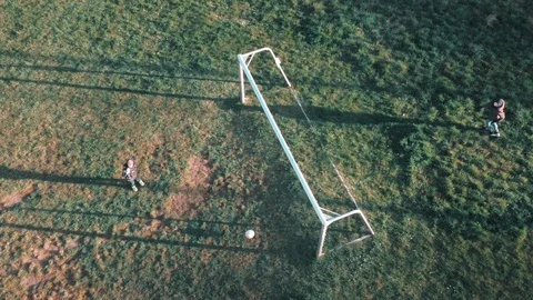 Drone flight over Kids playing football ... | Stock Video | Pond5