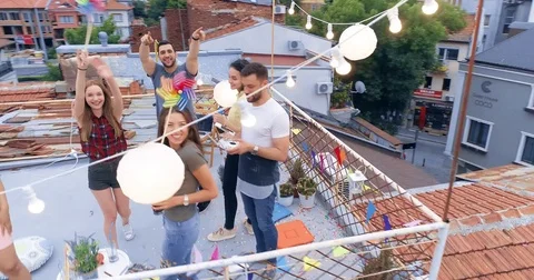 Drone Flight Over Rooftop Diverse Young ... | Stock Video | Pond5