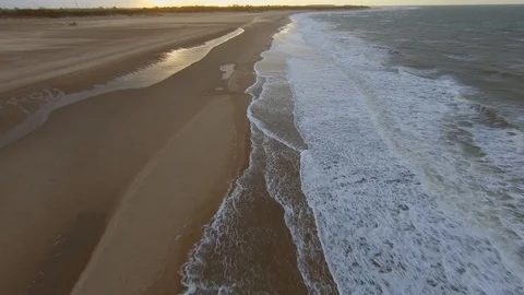 Drone flying fast and low at the beach t... | Stock Video | Pond5