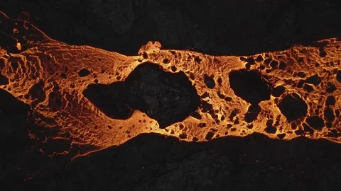 Drone flying over golden magma running t... | Stock Video | Pond5