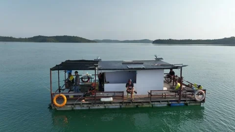 Drone Footage Fishing using Wooden Raft ... | Stock Video | Pond5