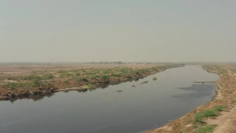 Drone footage over a channel of Bhadar R... | Stock Video | Pond5