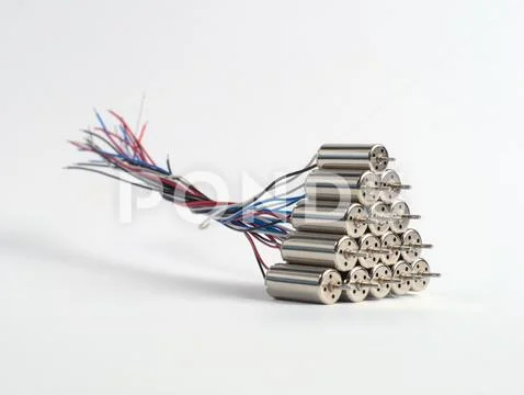 The drone micro-motors stand in a pyramid-shaped pile. White background ...