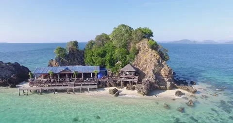 Drone moving above a small island with h... | Stock Video | Pond5