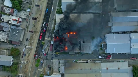 Drone overhead view of a factory on fire... | Stock Video | Pond5