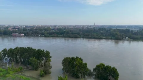 Drone panning shot of a river with a dis. Stock Video Pond5