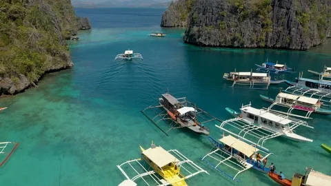 Drone pull up shot at lagoon in Coron Pa... | Stock Video | Pond5