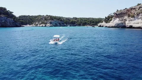 Drone shot of Boat leaving shore Between... | Stock Video | Pond5