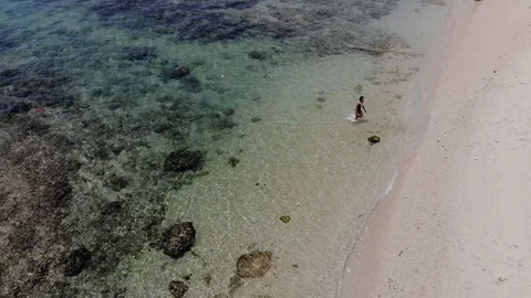 Drone shot circling female model walking... | Stock Video | Pond5