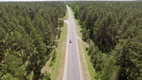 Drone Side View Camera Tracking Car Driv... | Stock Video | Pond5