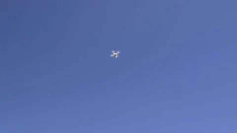 Drone in the sky filmed from the ground. | Stock Video | Pond5