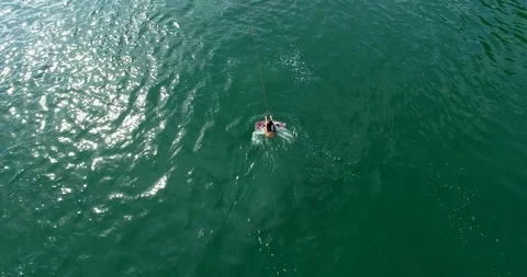Drone view of girl standing up in wakebo... | Stock Video | Pond5