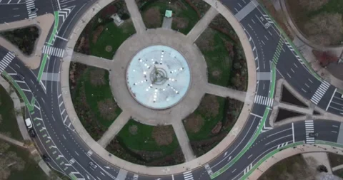 Drone view of a roundabout with trees in... | Stock Video | Pond5