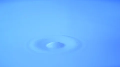 Drop of blue paint falling in slow motio... | Stock Video | Pond5