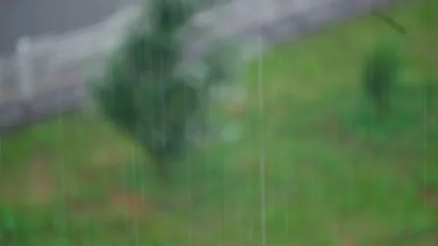 Drop fall to ground in heavy rain on a b... | Stock Video | Pond5