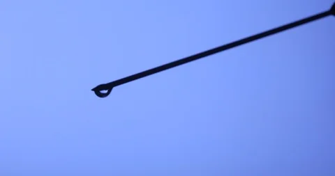 Drop falling from injection syringe | Stock Video | Pond5