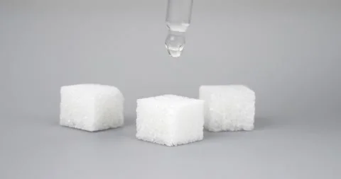a drop of lsd dripping into a sugar cube | Stock Video | Pond5