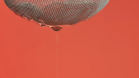 a drop of red syrup drips from a metal s... | Stock Video | Pond5