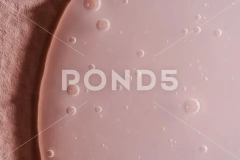 A drop of shampoo on a pink background. ~ Hi Res #150287388