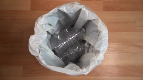 Dropping Plastic Bottles Into White Bin | Stock Video | Pond5
