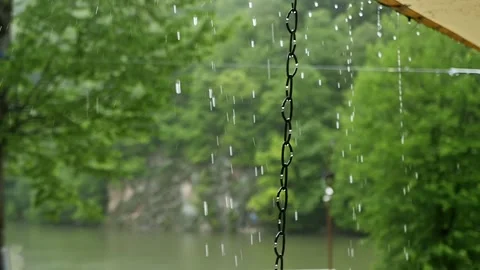 Drops of heavy rain drip from a canvas r... | Stock Video | Pond5